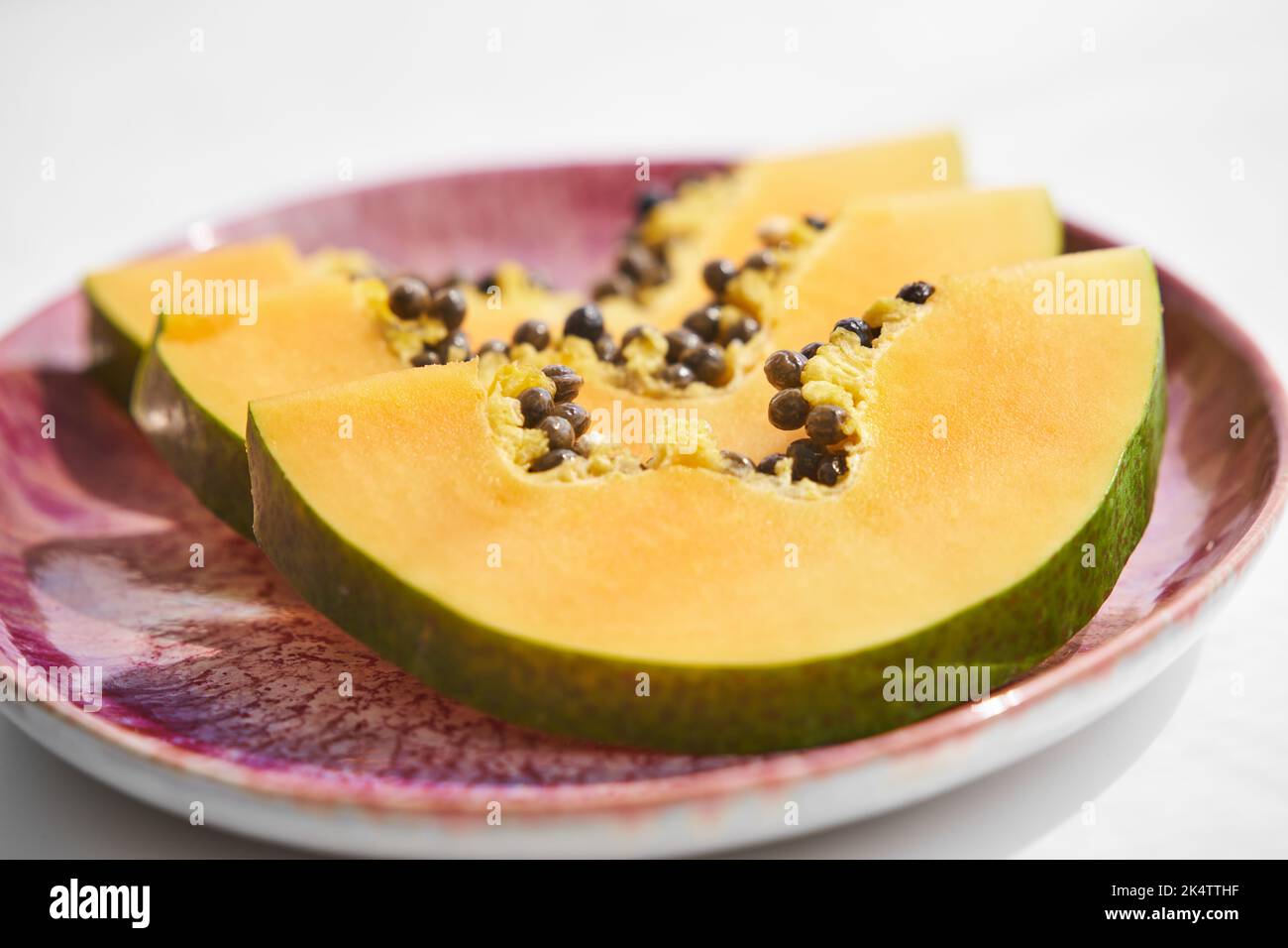 Sliced papaya on plate hi-res stock photography and images - Alamy