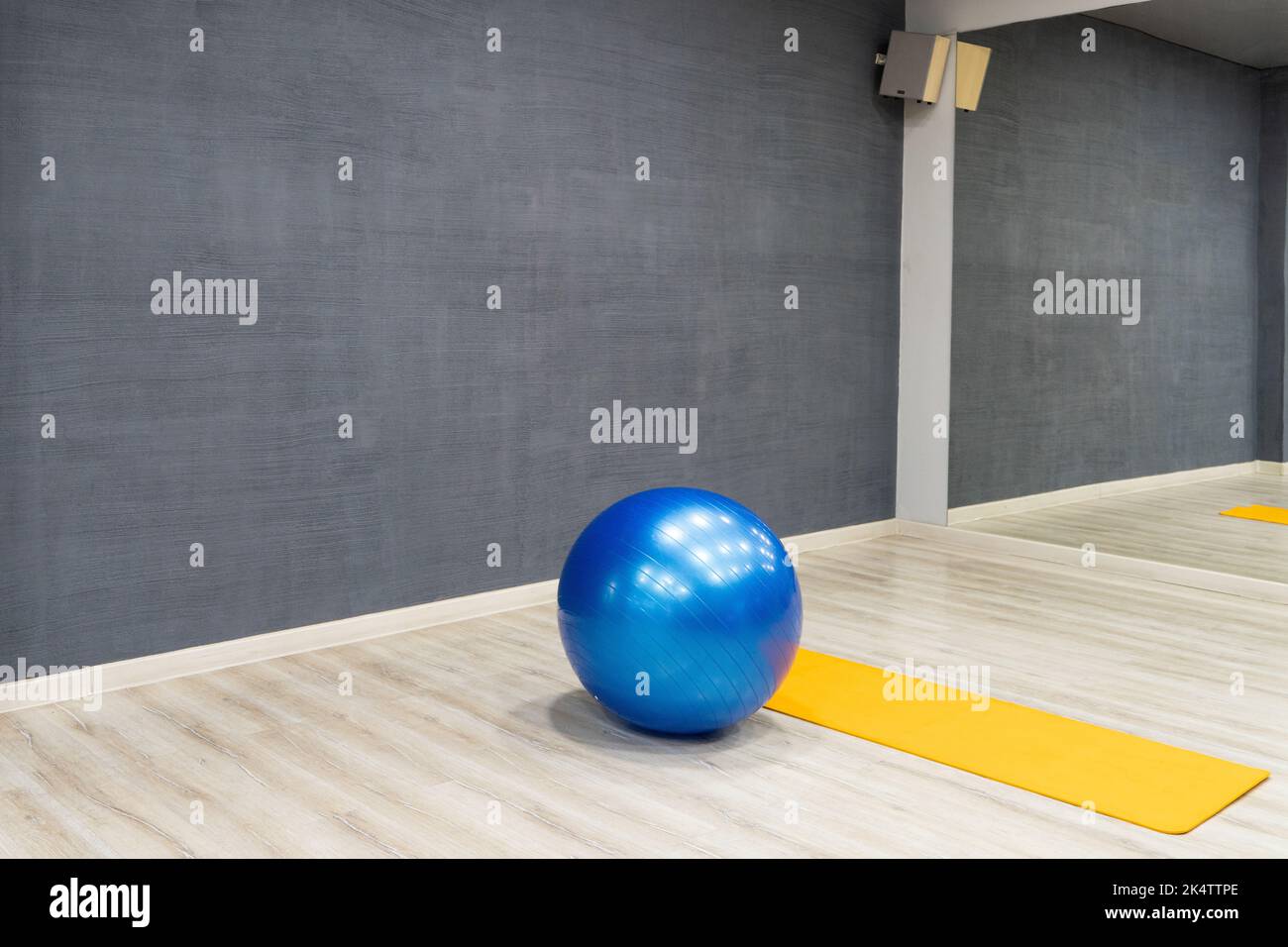 A blue exercise ball in the sports complex Stock Photo - Alamy