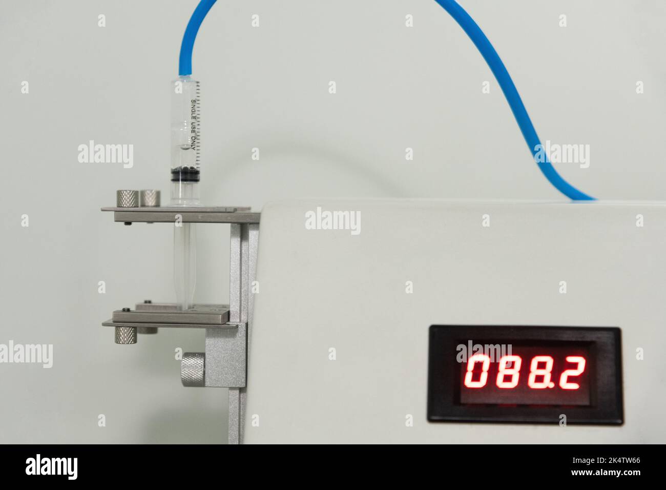 A closeup of the production and testing of medical syringes and ...
