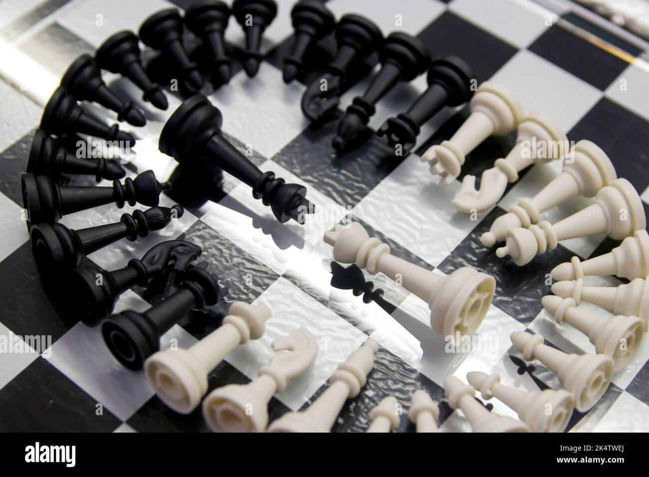 The black and white kings lying on the chess board in a circle of the ...