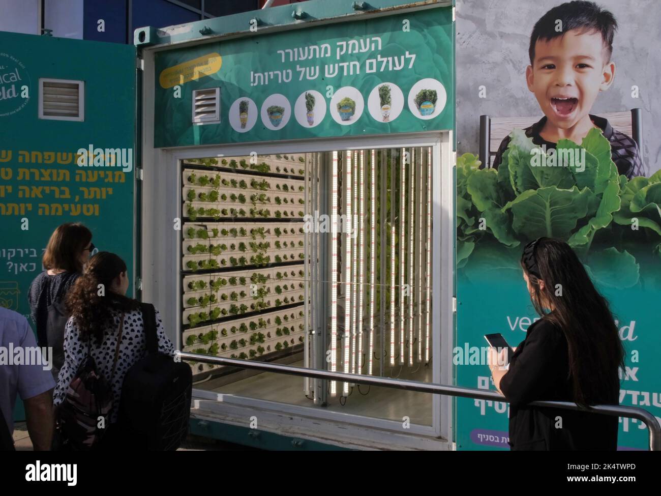 EMEK-HEFER, ISRAEL - OCTOBER 3: People look at a vertical farm unit of ...