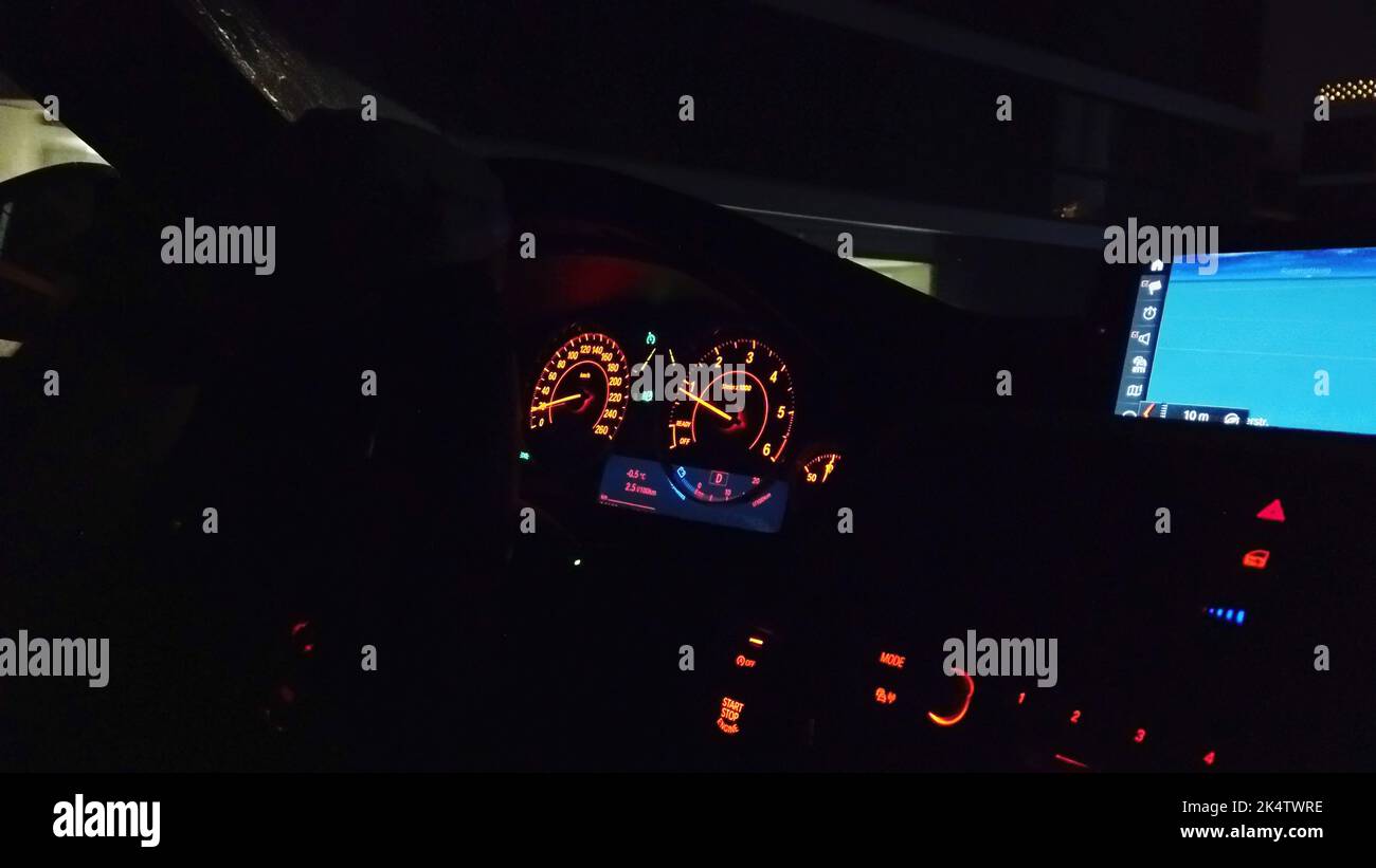 The interior of dark car with lights on screen and dashboard Stock ...