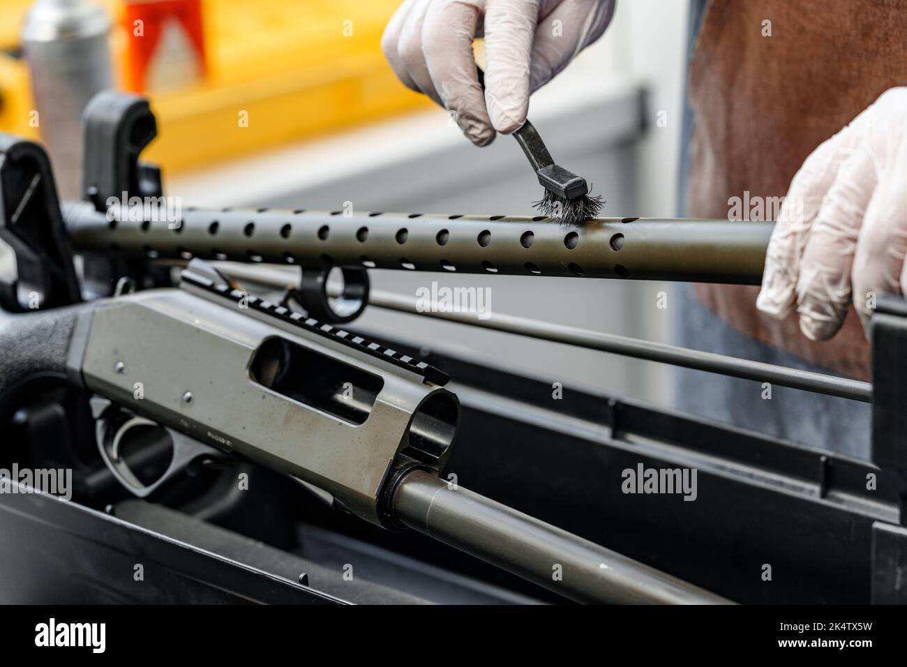 The gunsmith maintaining his rifle in a workshop Stock Photo - Alamy