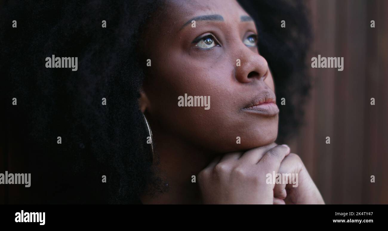 Worried black African woman close-up face Stock Photo - Alamy