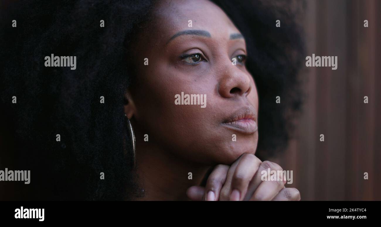 Worried black African woman close-up face Stock Photo - Alamy