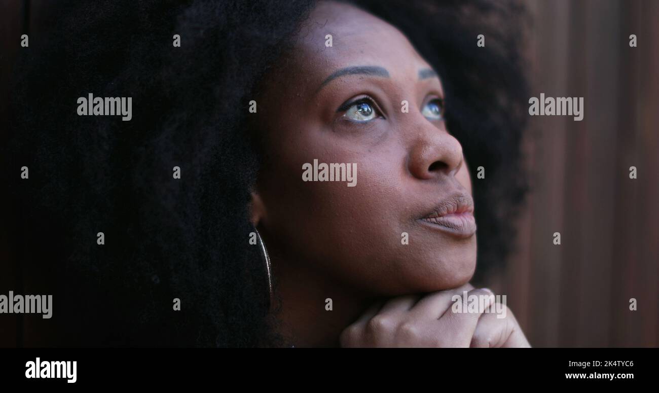 Worried black African woman close-up face Stock Photo - Alamy
