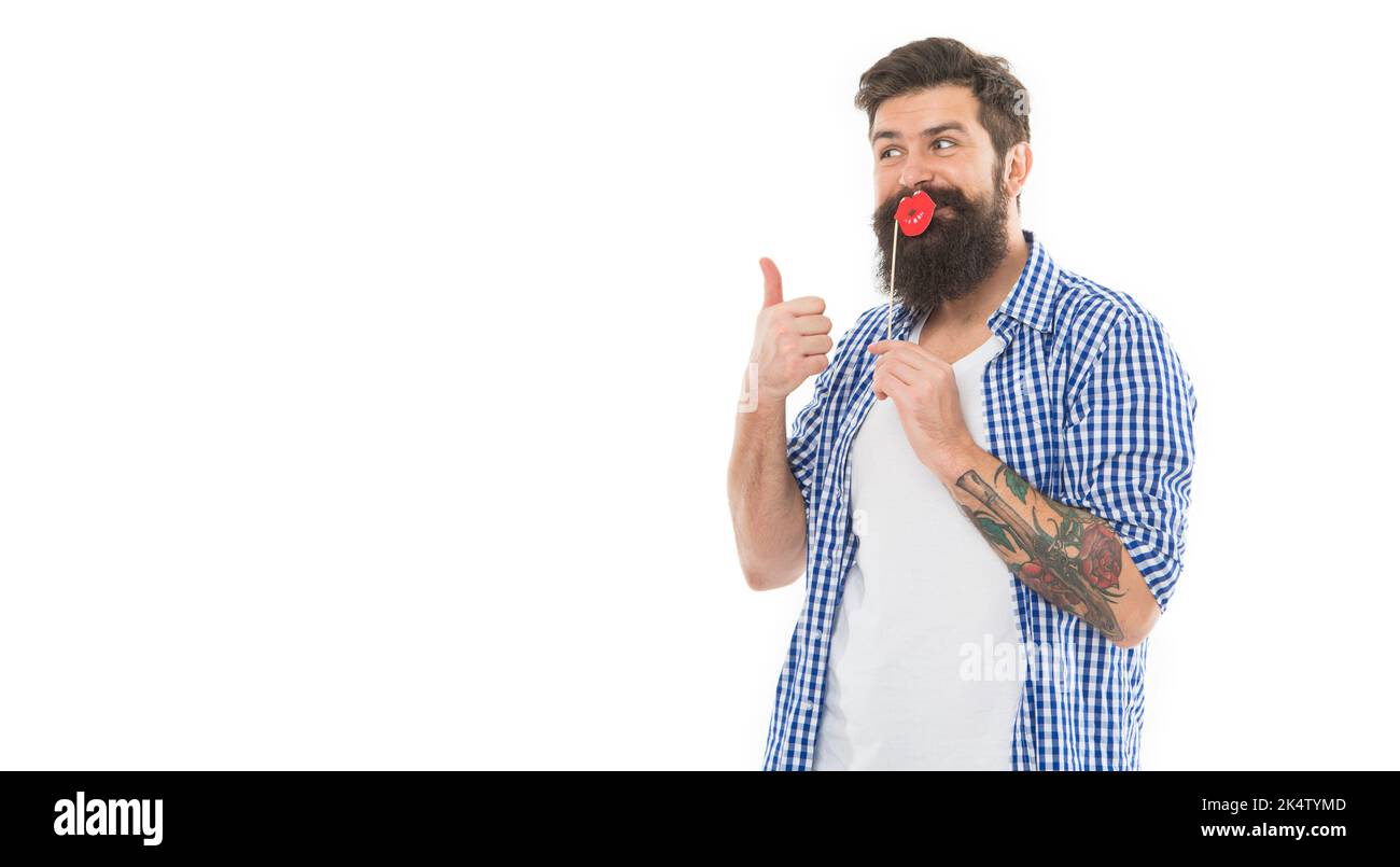 Happy smiling bearded man guy making fun with party lip props ...