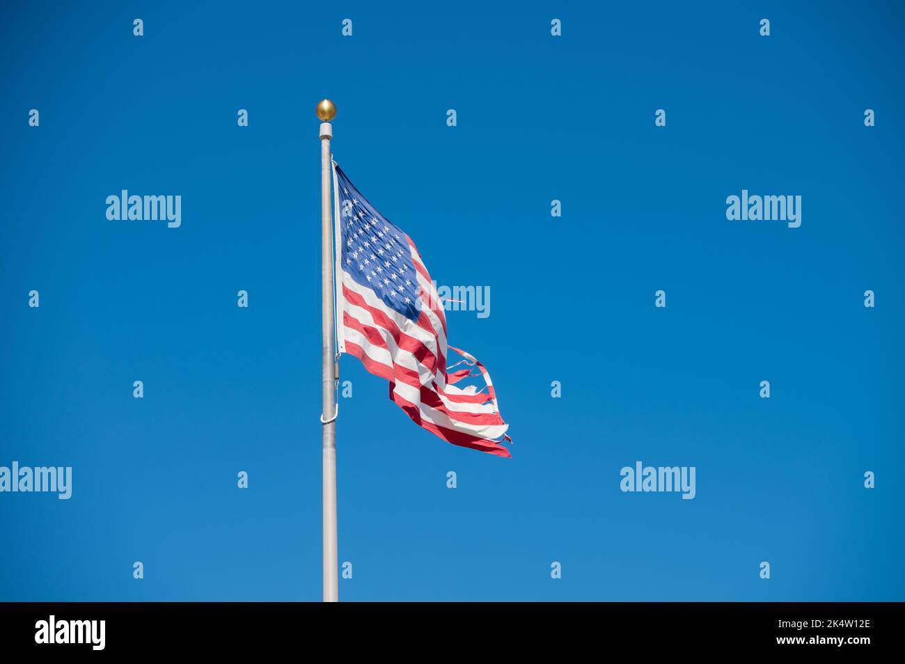 American flag seen on pole Stock Photo - Alamy