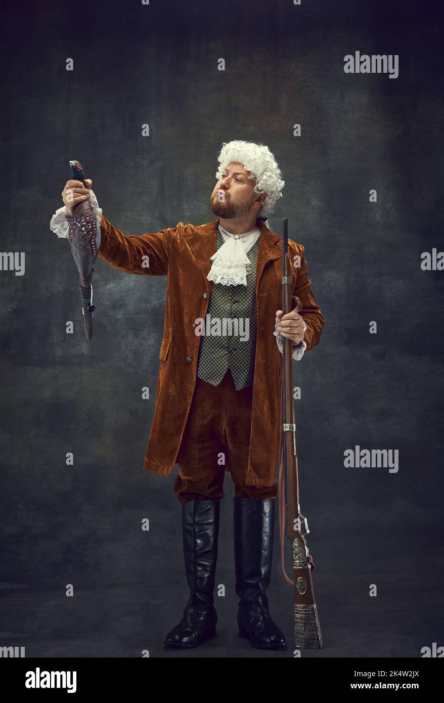Creative portrait of retro style hunter in vintage hunting clothing ...