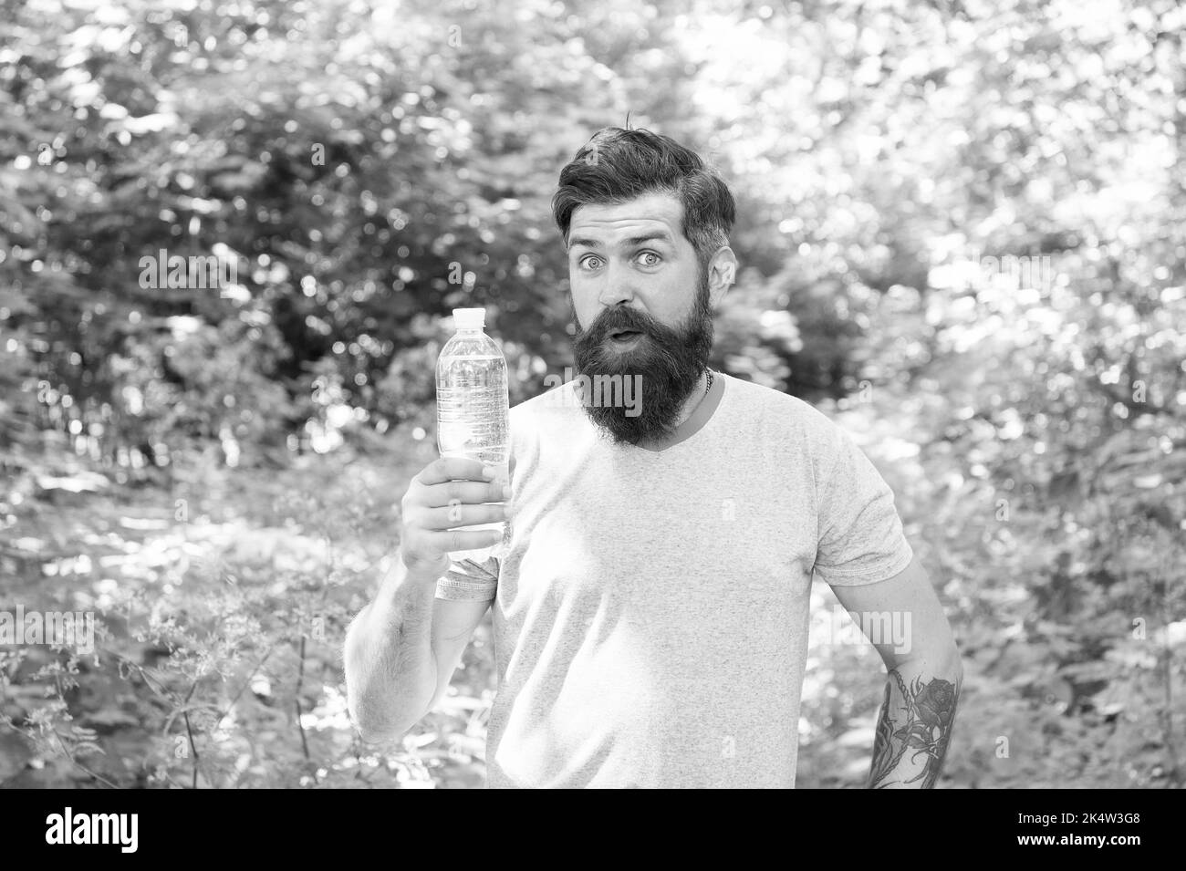 jogging drinking water. guy maintains body water balance. hydration ...