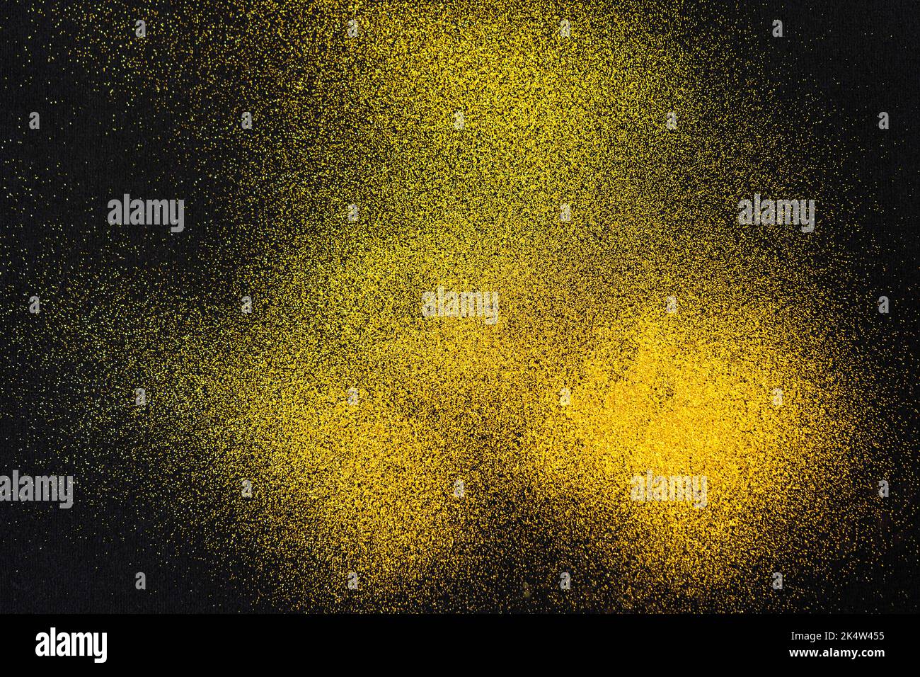 A minimal golden sand texture on a black background Stock Photo - Alamy