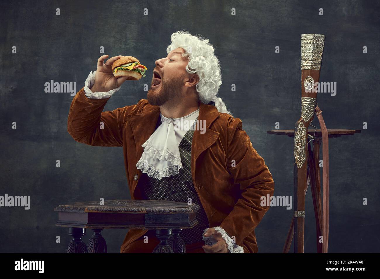 Fast food. Vintage portrait of young man in brown vintage suit and ...