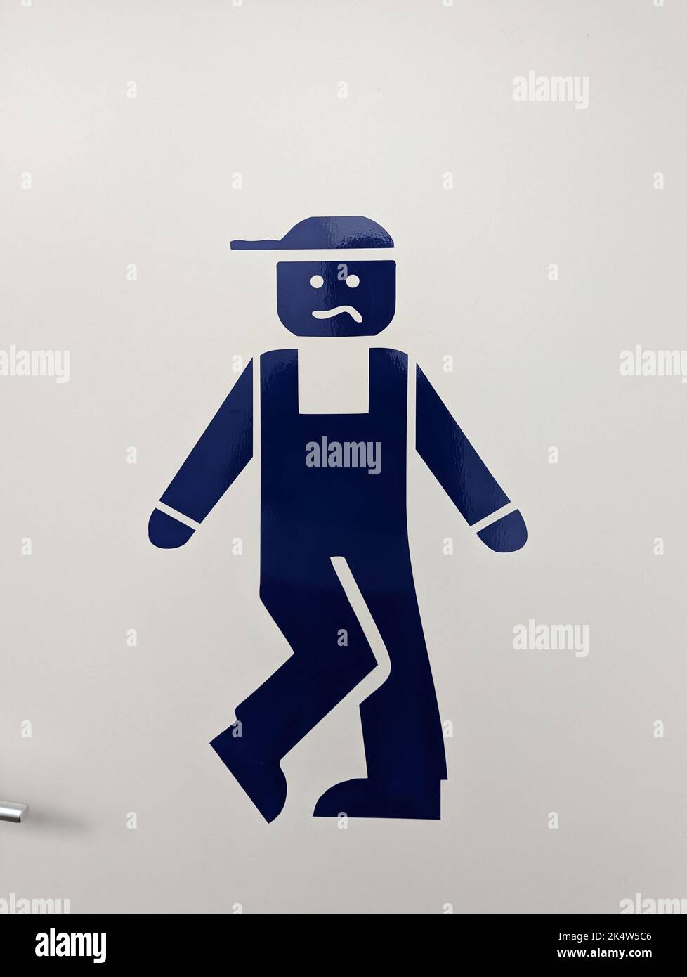 A vertical funny bathroom sign with blue male icon holding his pee ...