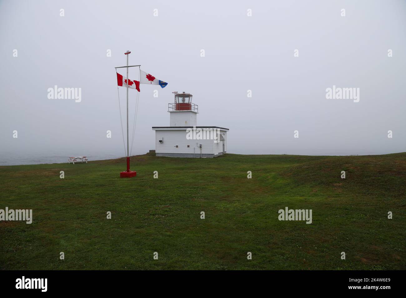 Grand Passage Lighthouse in the fog, Nova Scotia Stock Photo - Alamy