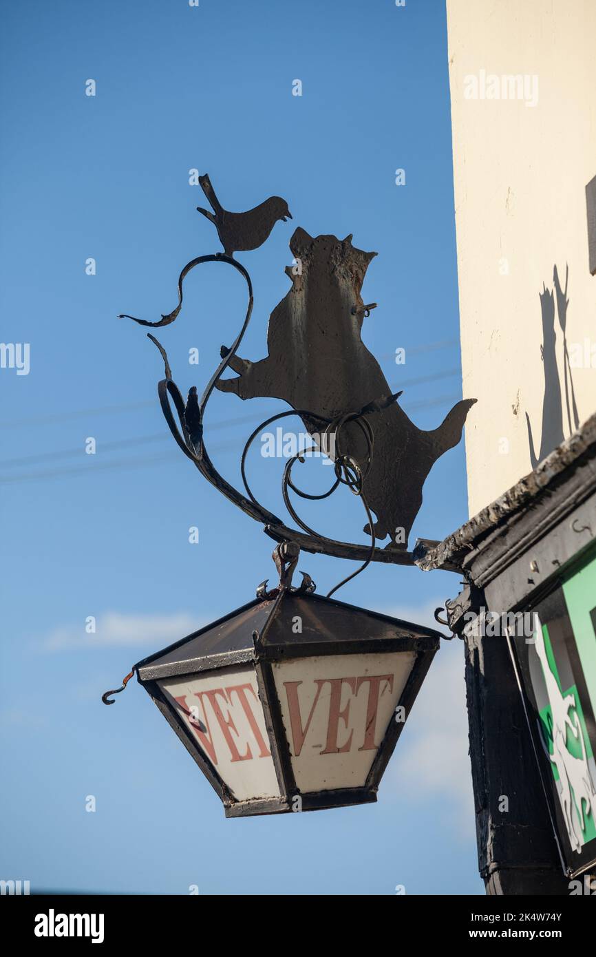 A vintage vet sign in Dunblane with a silhouette of a dog and a bird ...