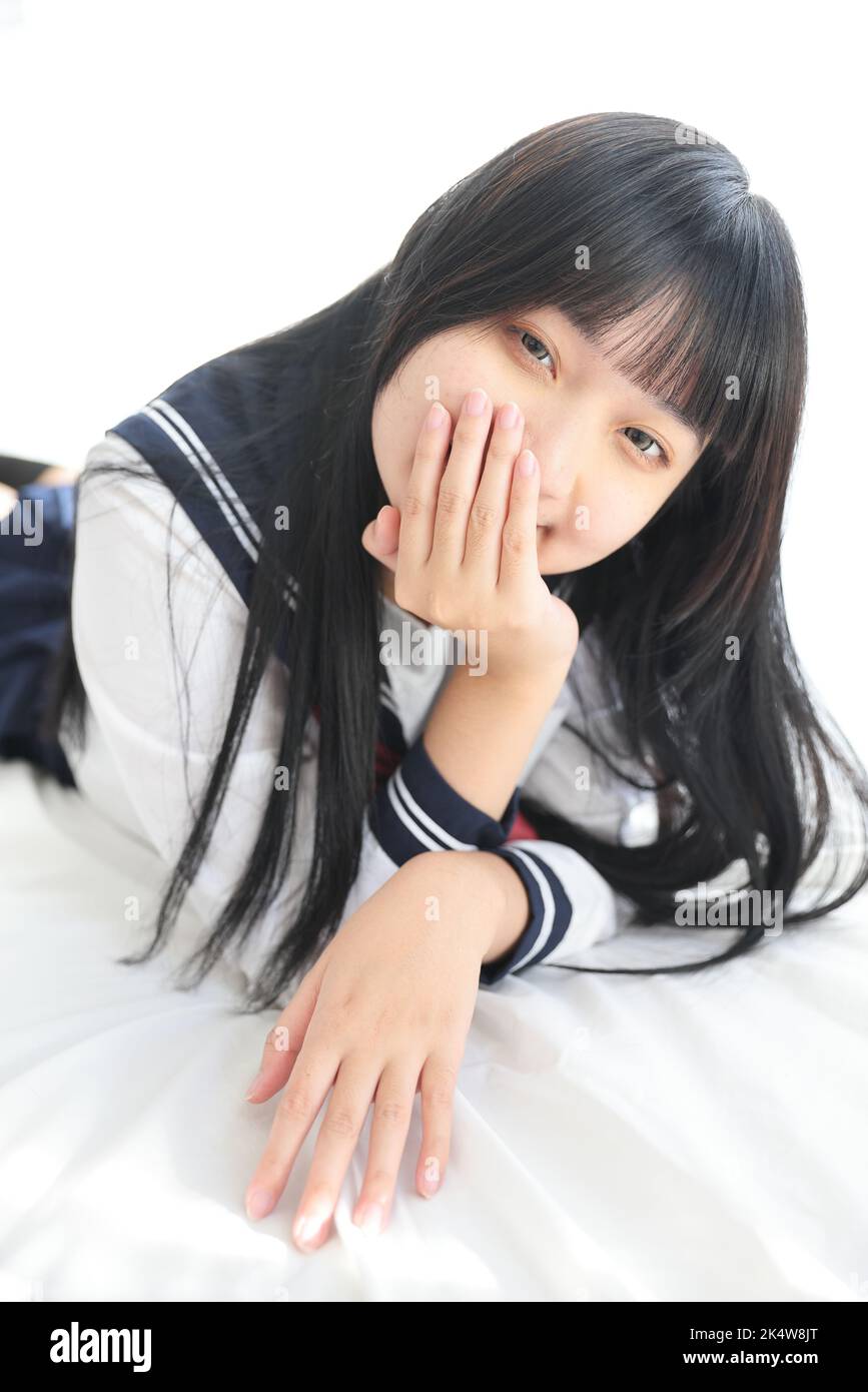 Asian High School Girls student smile while sleeping in white room Stock Photo - Alamy
