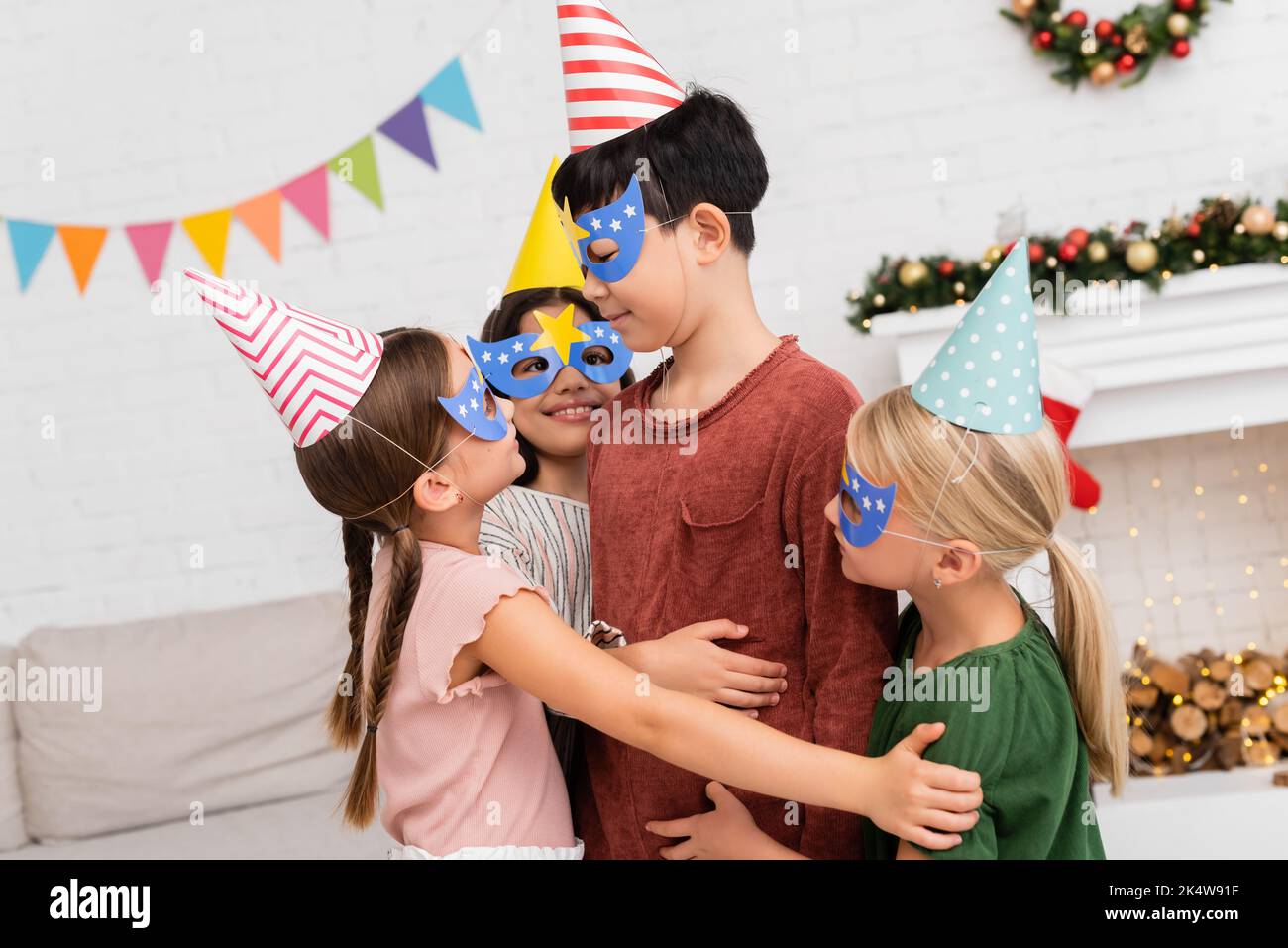 Smiling girls hugging birthday party hi-res stock photography and ...