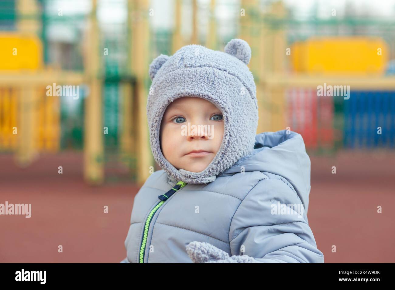 Little toddler boy having fun on playground outdoors Stock Photo - Alamy