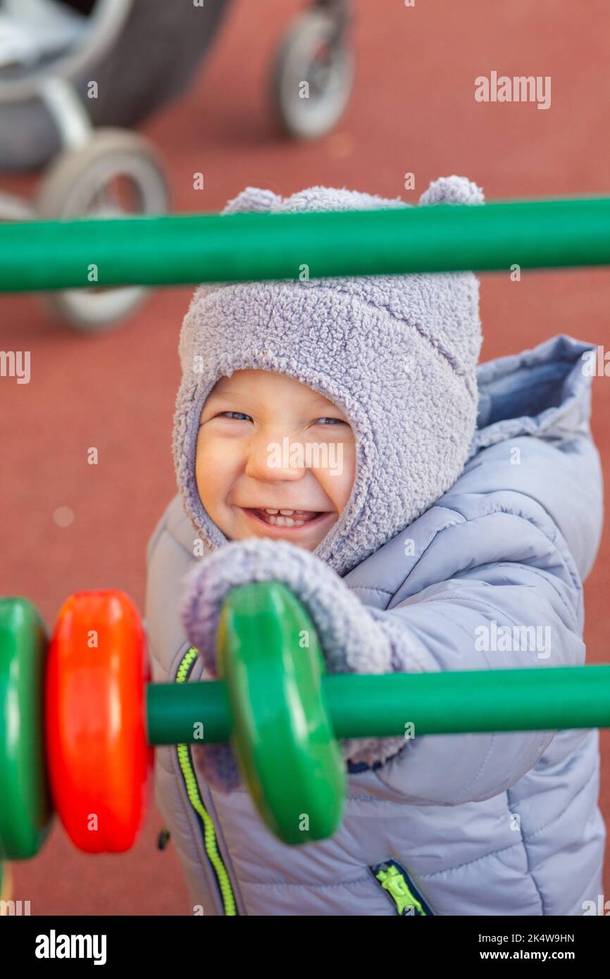 Little toddler boy having fun on playground outdoors Stock Photo - Alamy