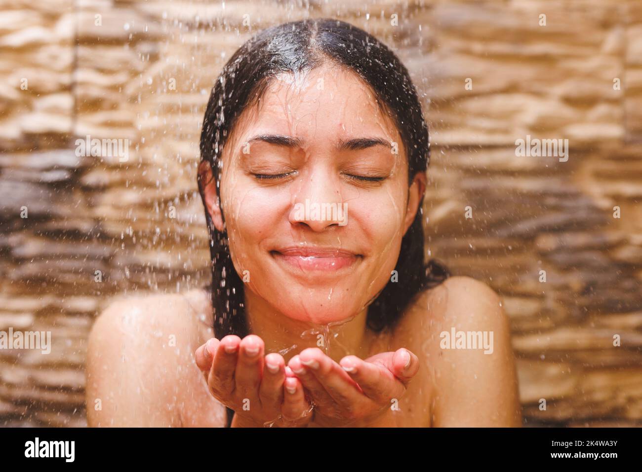 Happy Biracial Woman Taking Shower Washing Hair In Bathroom Stock