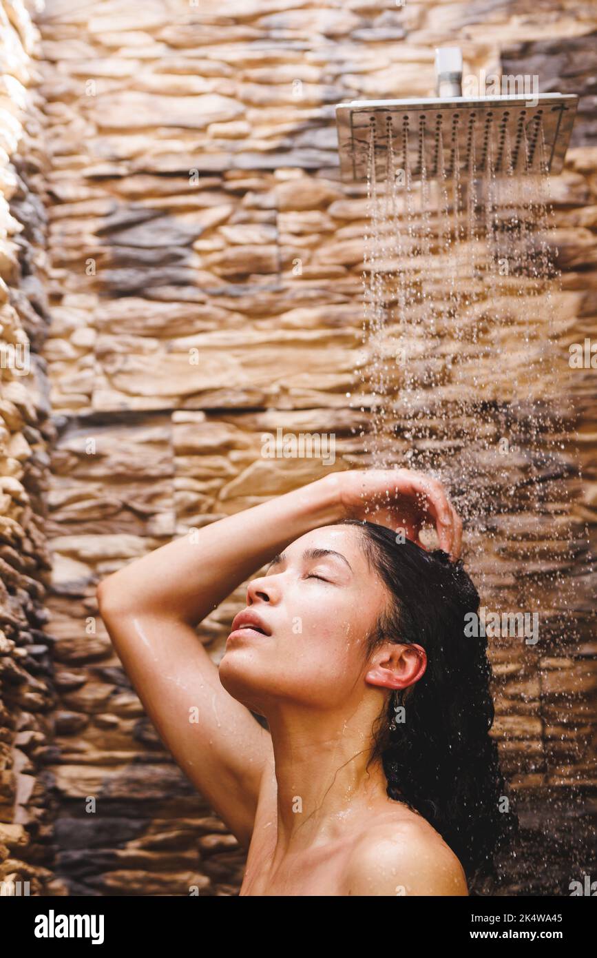 Happy Biracial Woman Taking Shower Washing Hair In Bathroom Stock
