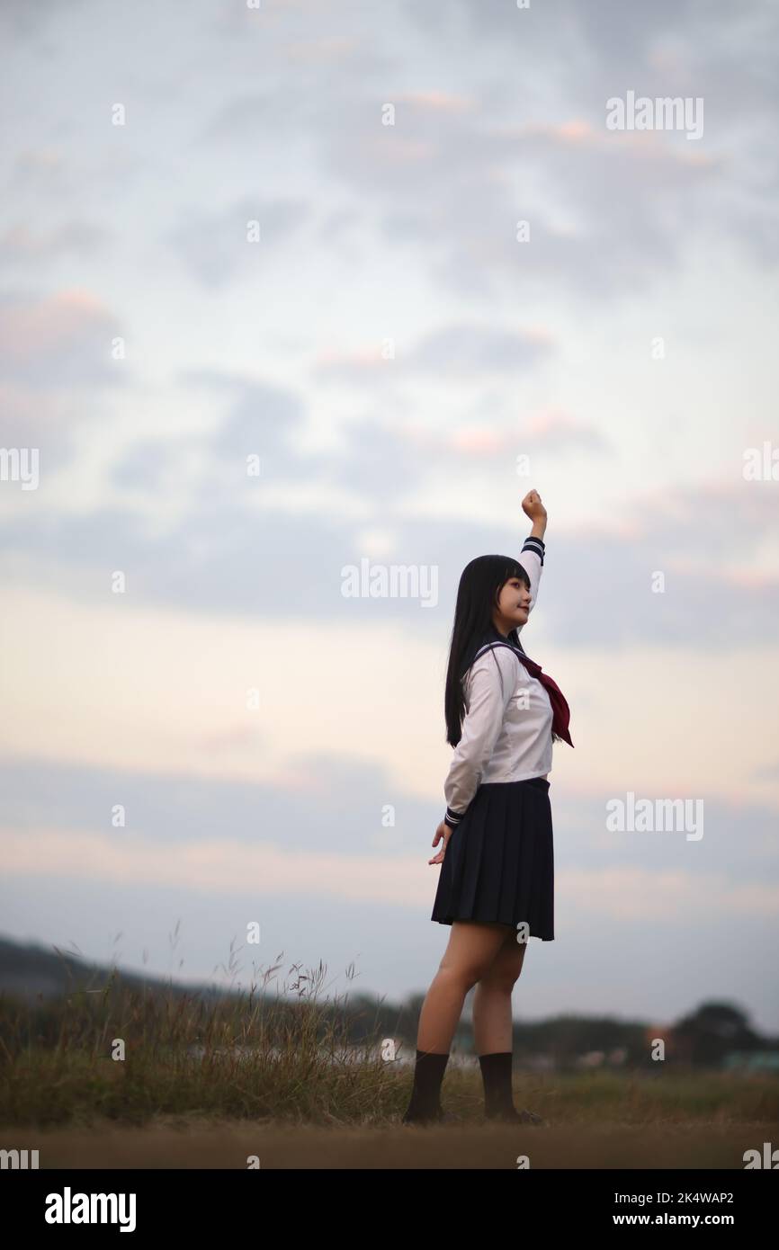 Asian High School Girls student looking at camera in countryside with sunrise Stock Photo - Alamy