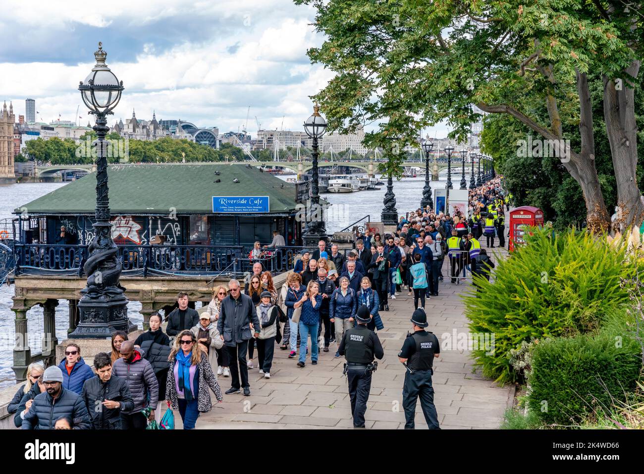 British People and People From Around The World Queue By The Side Of ...