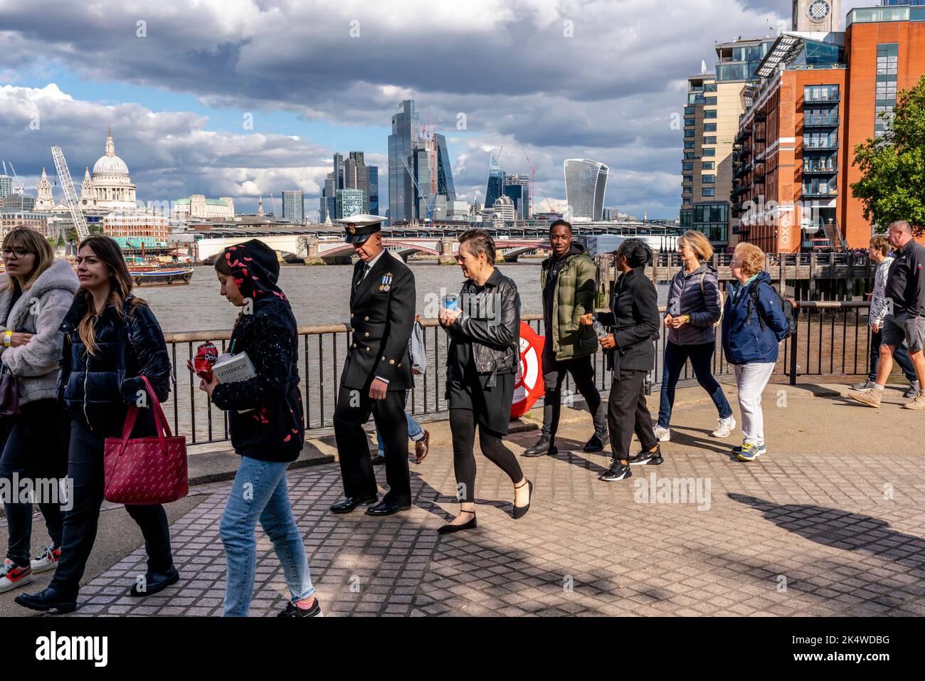British People and People From Around The World Queue Along The ...