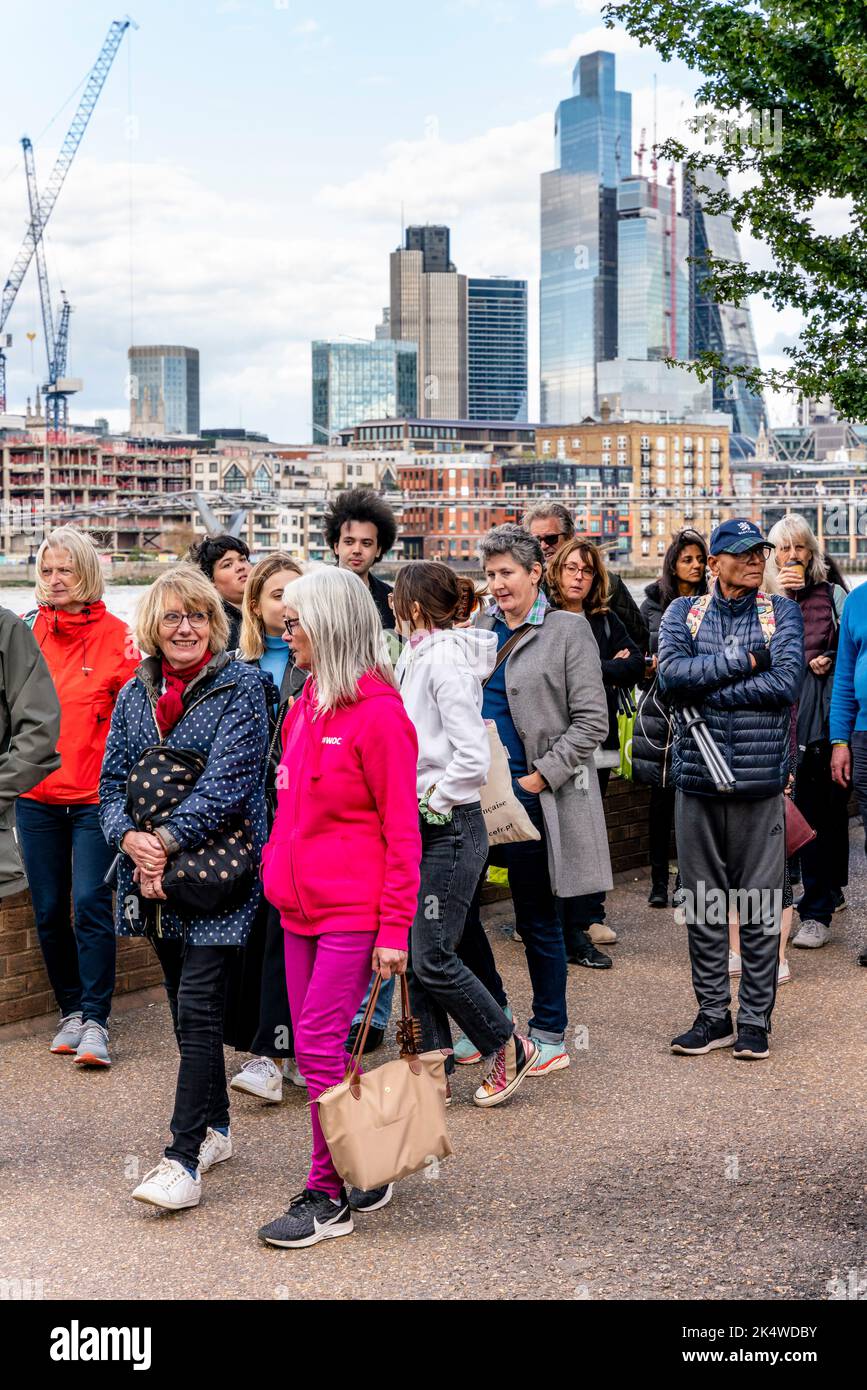 British People and People From Around The World Queue Along The ...