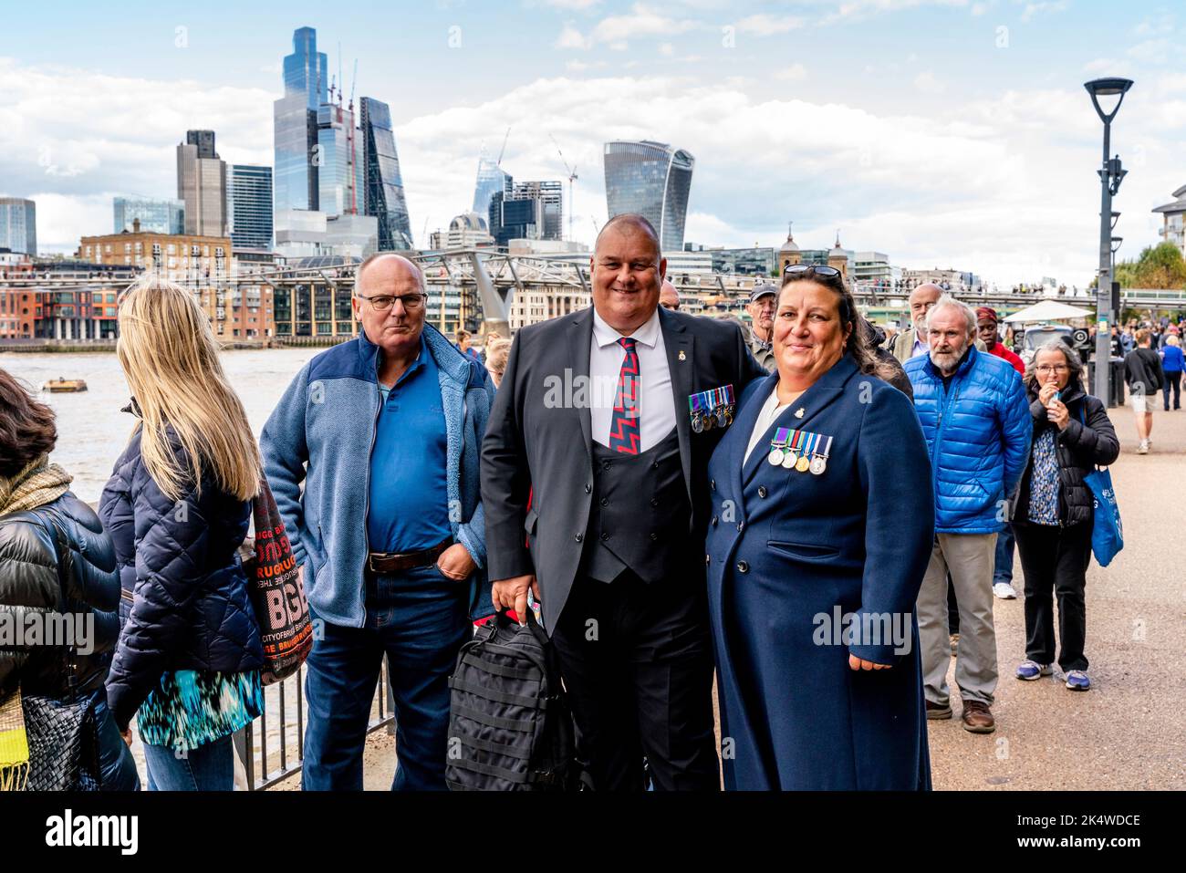 British People and People From Around The World Queue Along The ...