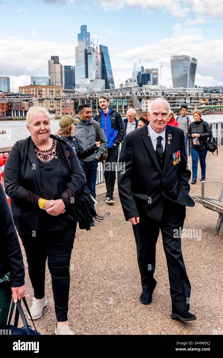 British People and People From Around The World Queue Along The ...
