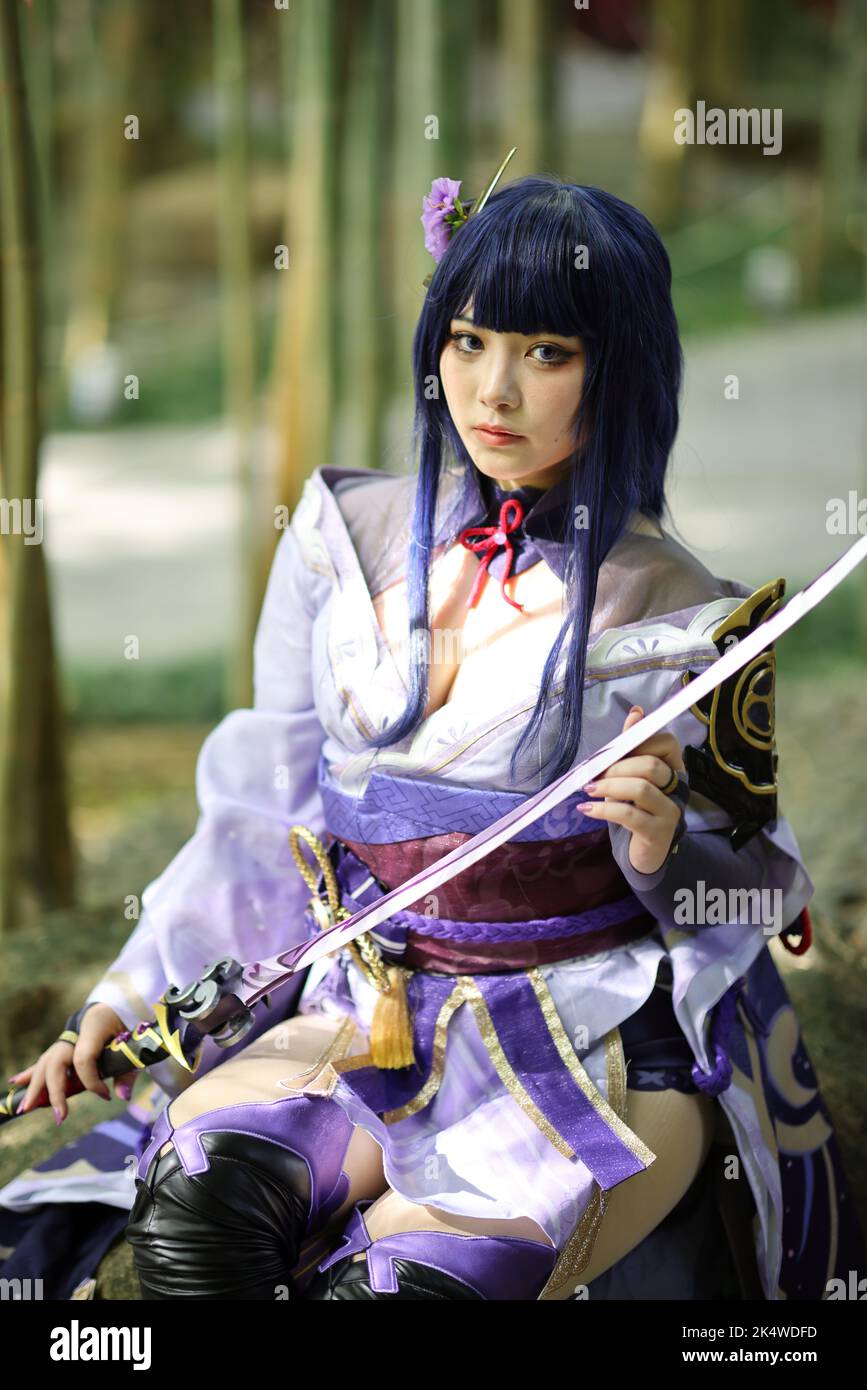 Portrait of a beautiful young woman game cosplay with samurai dress ...