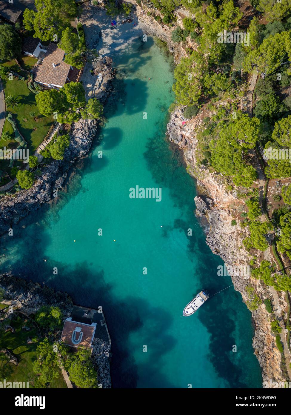 Aerial view of boats in a coastal bay, Cala Marmols, Majorca, Spain ...