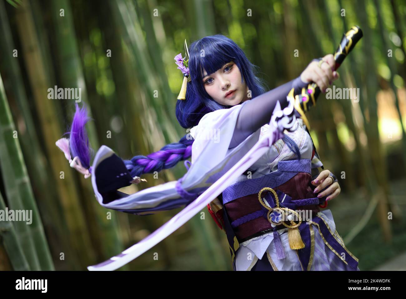Portrait of a beautiful young woman game cosplay with samurai dress ...