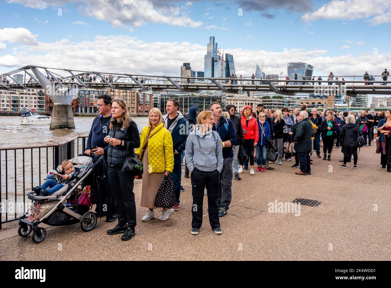 British People and People From Around The World Queue Along The ...