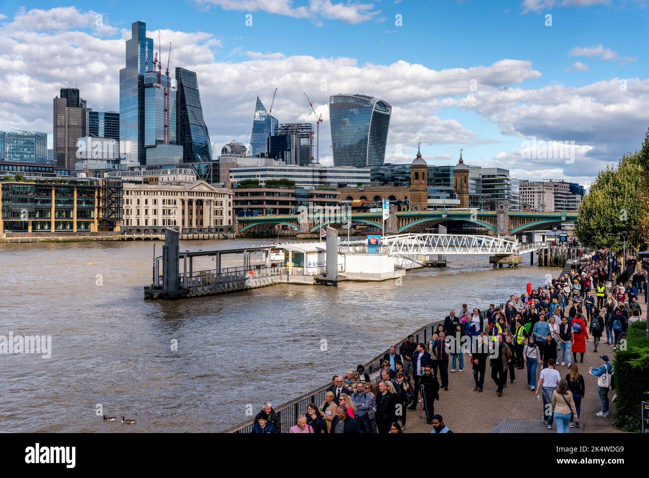 British People and People From Around The World Queue Along The ...