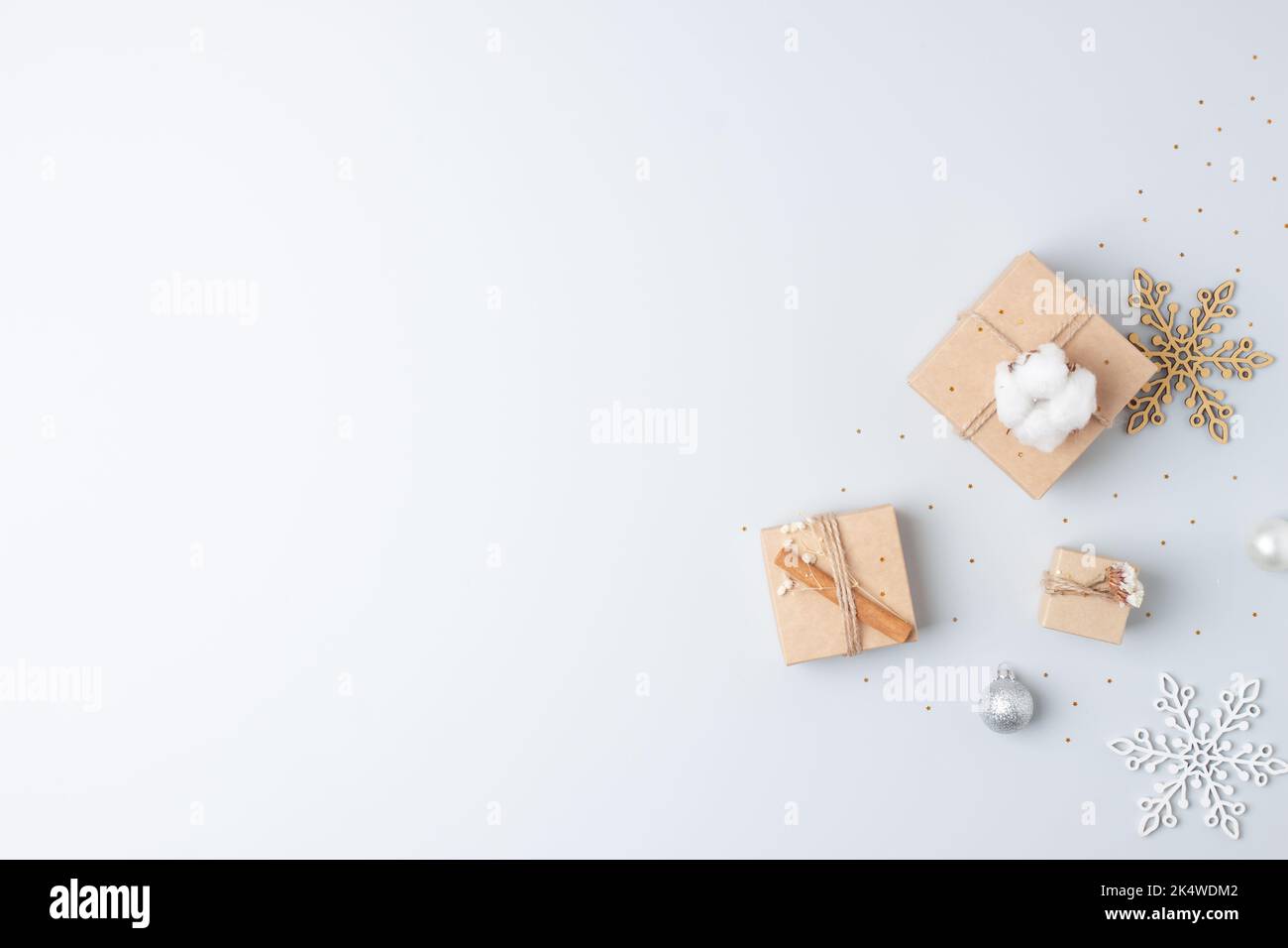 Christmas decorations with packaging gifts in craft paper and flower on ...