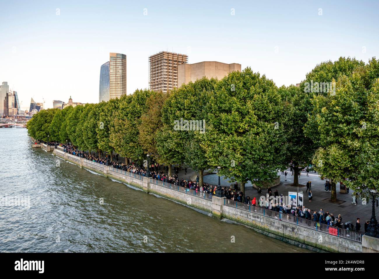 British People and People From Around The World Queue Along The South ...
