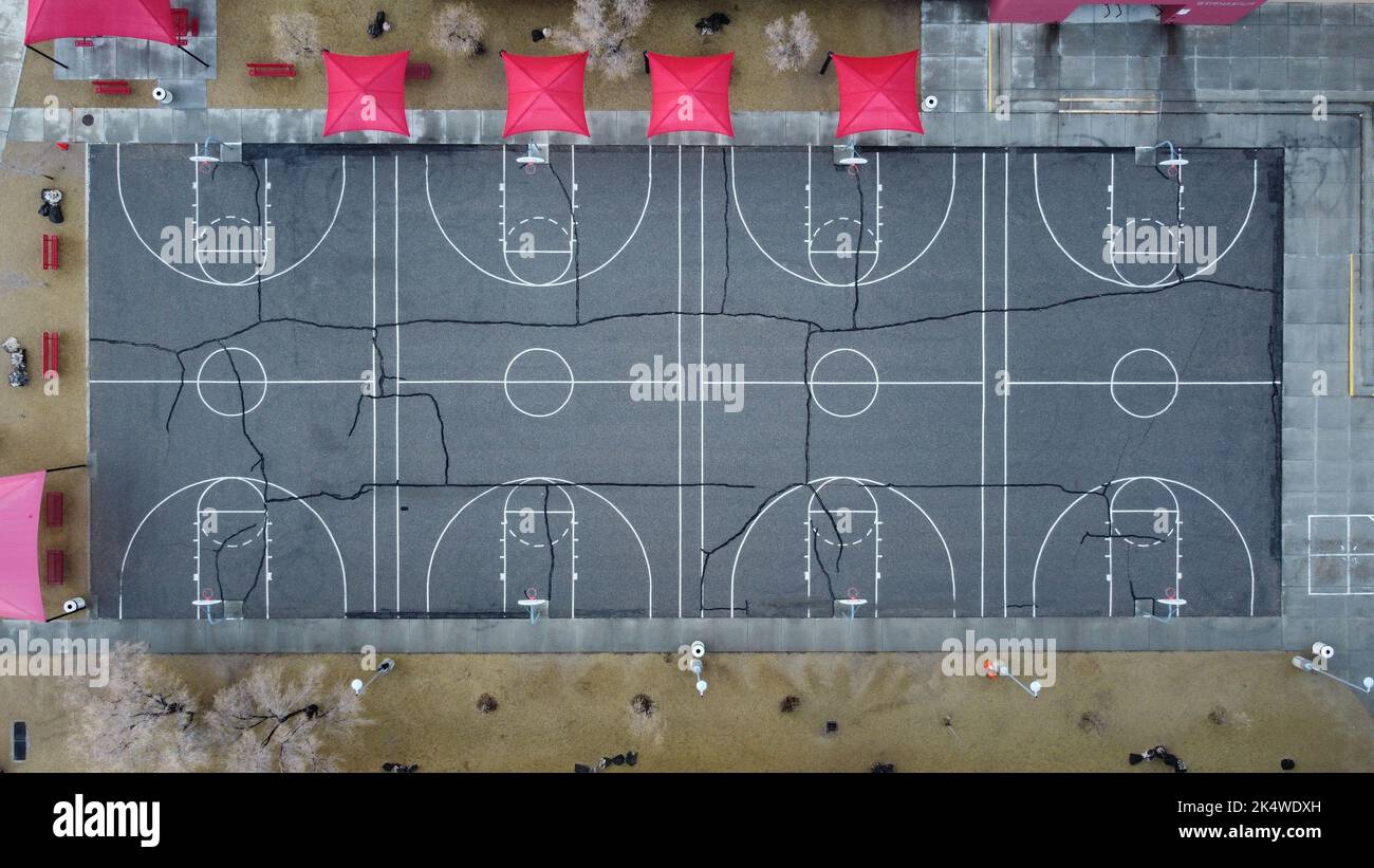 An aerial top down view of a basketball court at a school captured ...