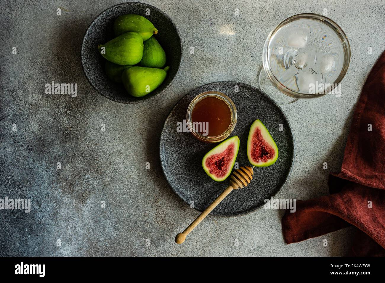 Overhead view of ripe green figs with honey and a cocktail Stock Photo ...