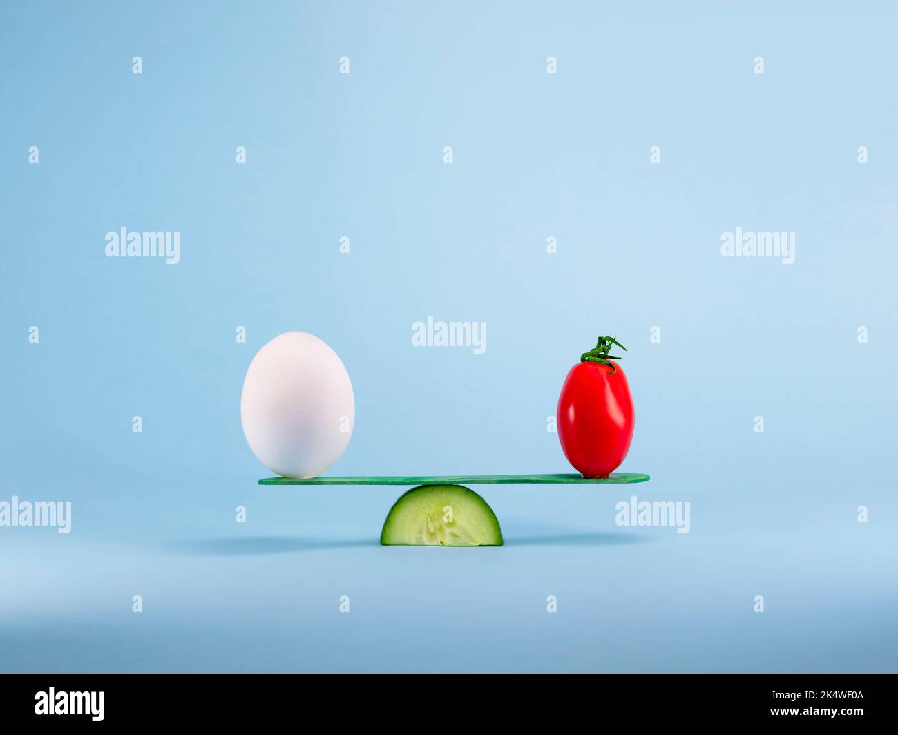 Healthy eating and food balance concept with food on a seesaw Stock ...