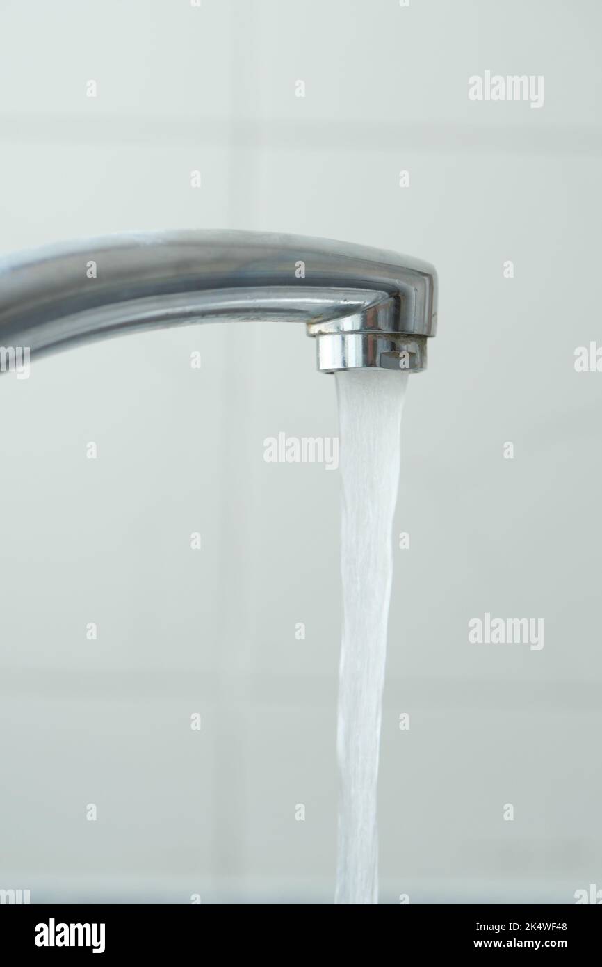 water pouring from a faucet tap slow motion Stock Photo - Alamy