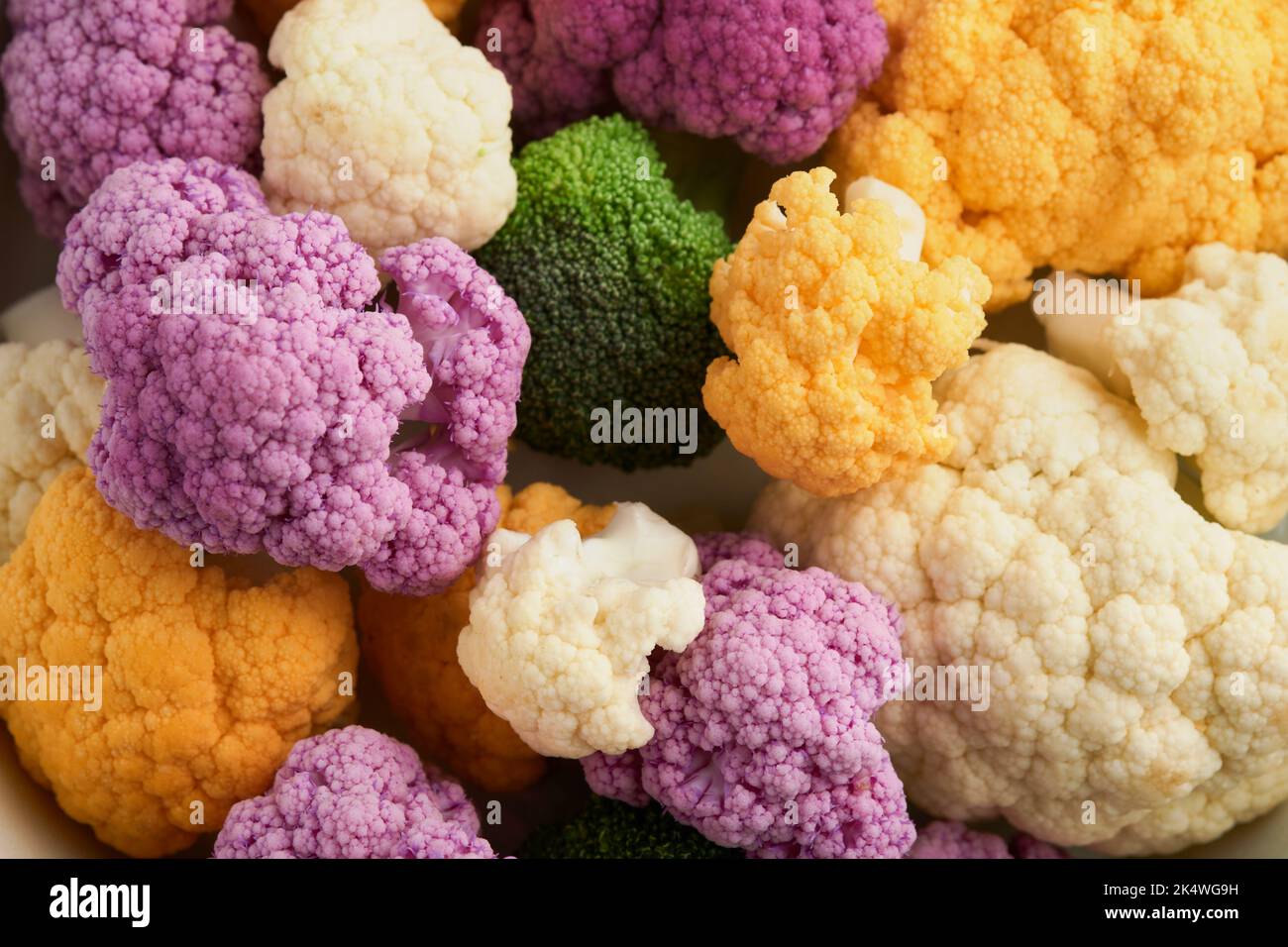 Colorfu cauliflower. Cauliflower cut into small pieces in red iron ...