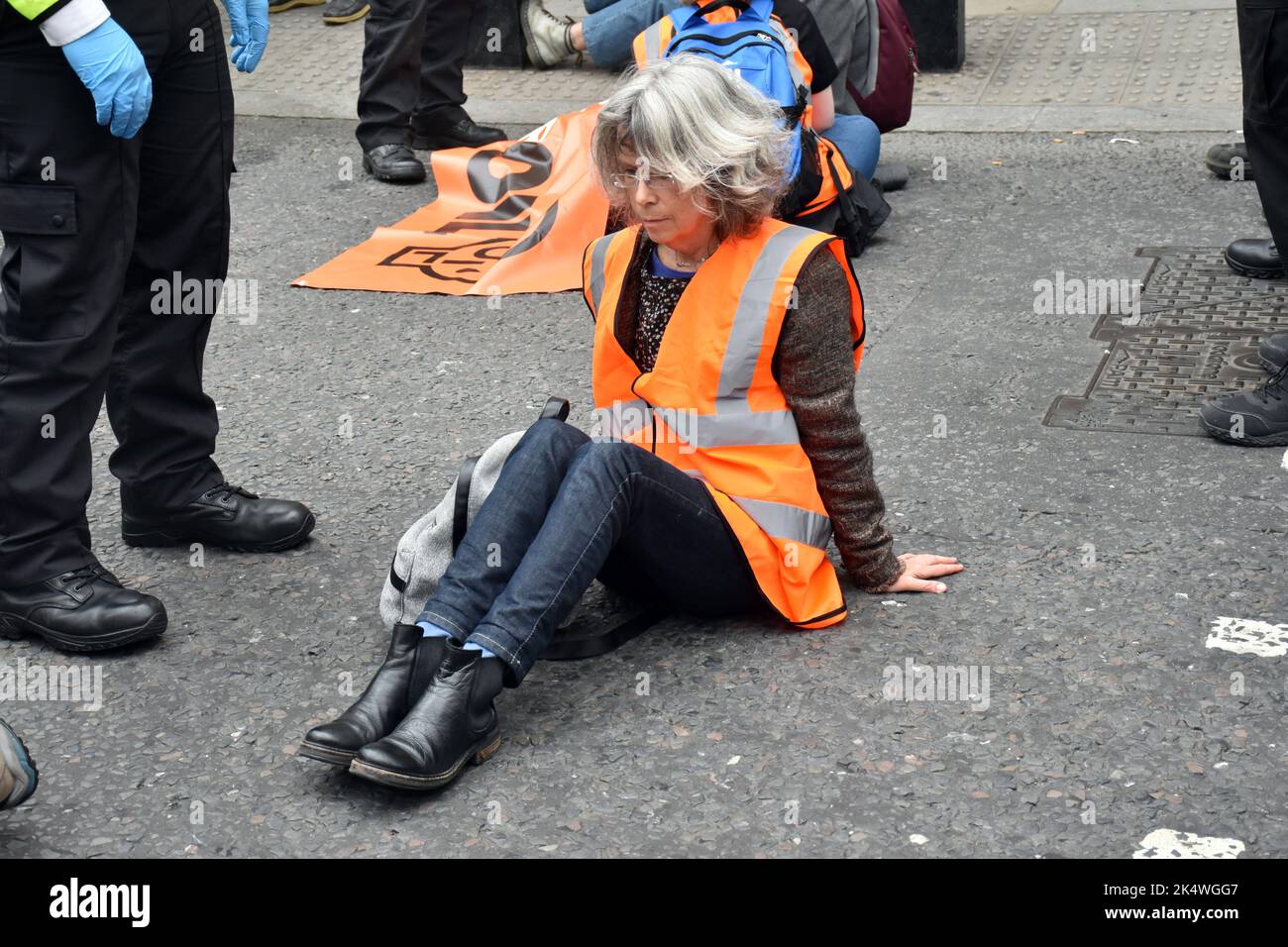 London, UK. 4th Oct, 2022. Just Stop Oil protesters glue themselves to ...