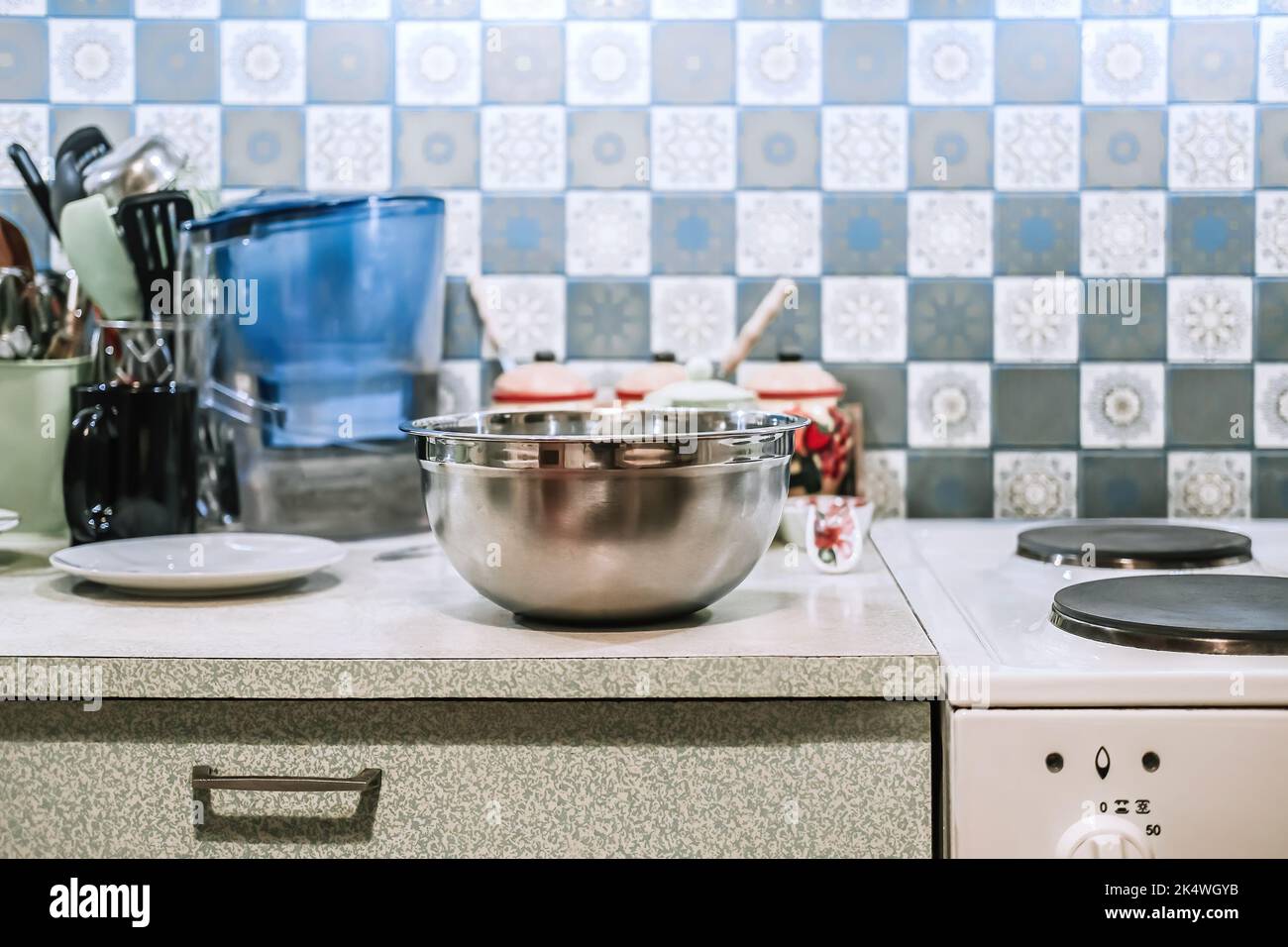 Utensils are on kitchen table. Food preparation process. Kitchen close ...