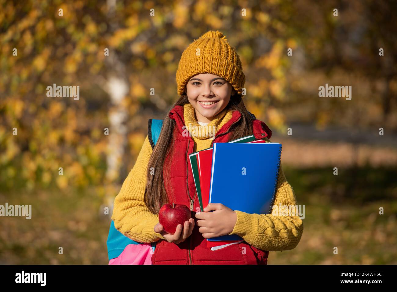 positive teen girl back to high school in autumn Stock Photo - Alamy