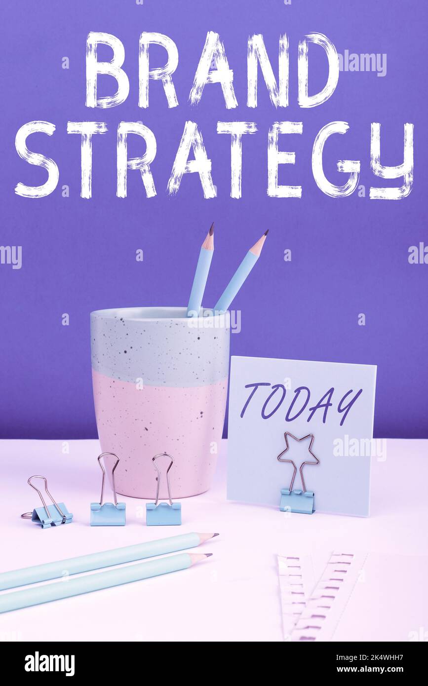 Writing displaying text Brand Strategy. Business overview longterm plan ...