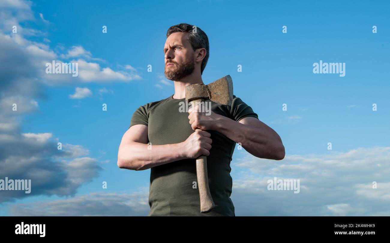 strong man with axe. caucasian man hold ax. brutally man on sky ...