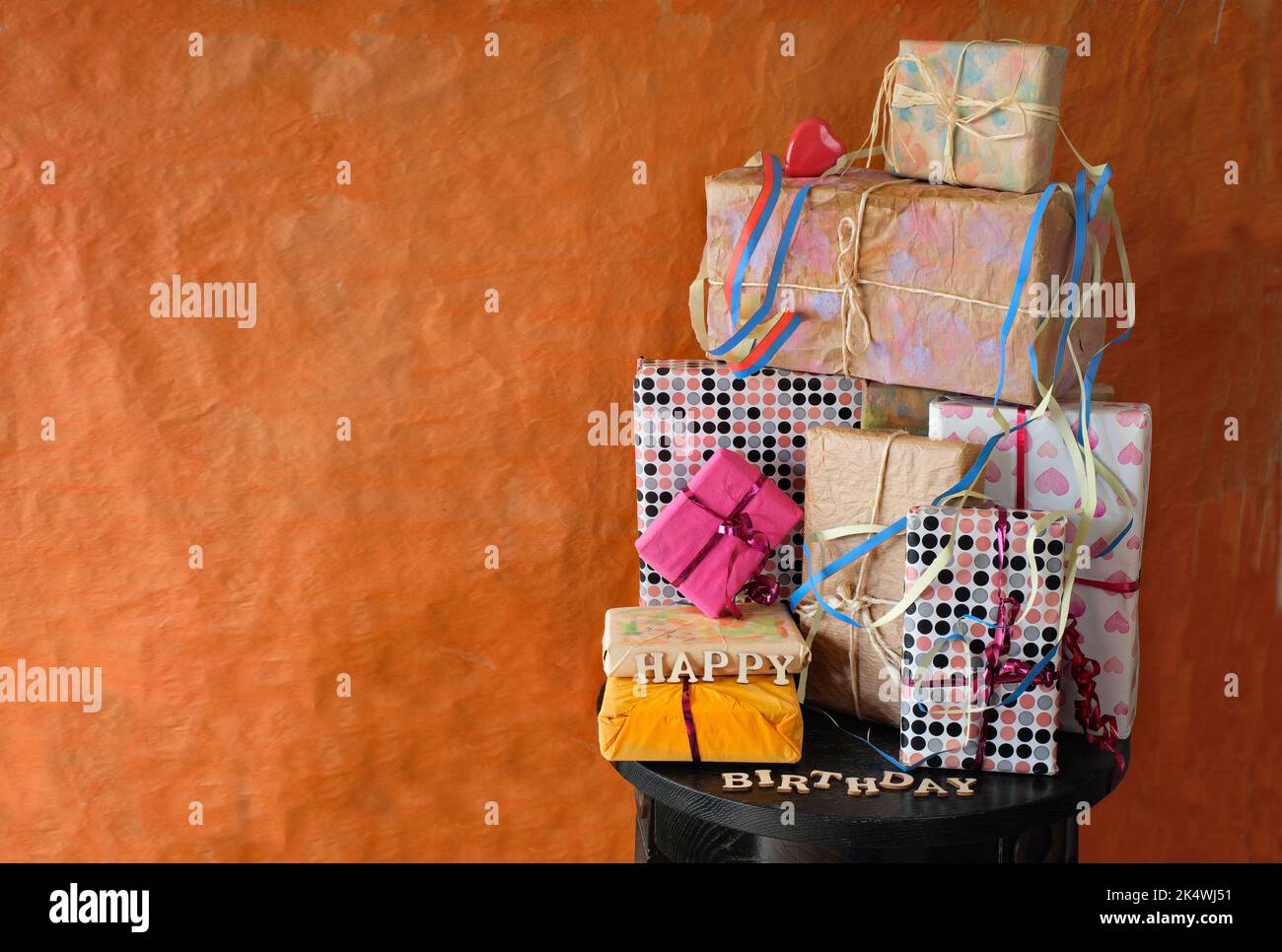 heap of birthday presents and caption happy birthday,personal gifts and ...