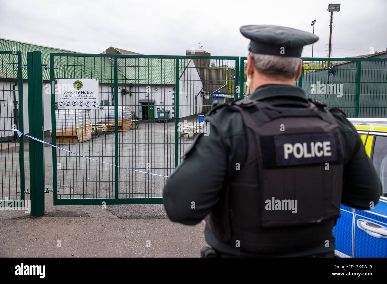 An officer from the PSNI at the scene following a shooting on Sunday of ...